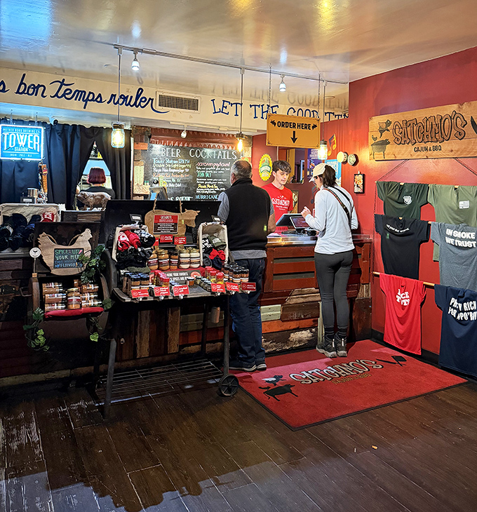 Where culinary dreams come true &ndash; the ordering counter showcases Satchmo's merchandise alongside their "Let the good times roll" philosophy.