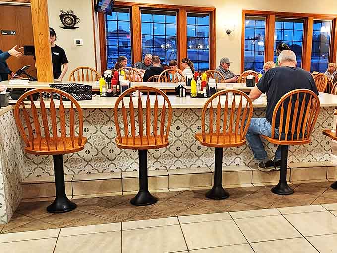 Counter seating offers front-row views of breakfast theater, where short-order choreography turns fresh ingredients into morning masterpieces.
