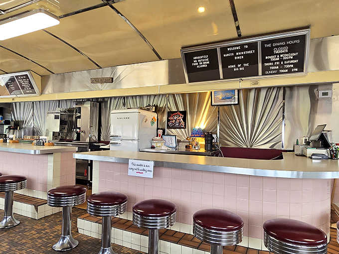 Counter seating: where solo diners become part of the Nancy's family and regulars exchange news over endless coffee refills.