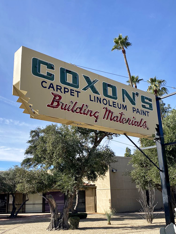Coxon's sign advertises carpet, linoleum, and paint with the kind of enthusiasm that makes you think, "Maybe I DO need new flooring!" That's vintage advertising magic.