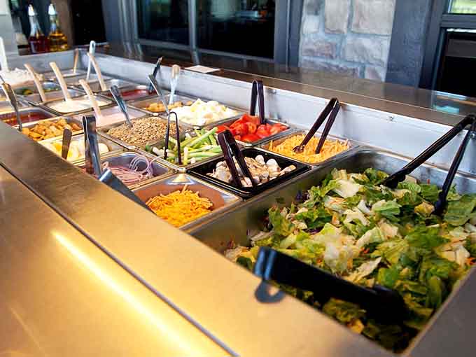 The salad bar offers fresh ingredients and variety, letting you customize your meal's beginning exactly how you want.