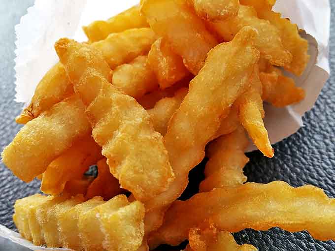 These aren't just any crinkle-cut fries &ndash; they're the gold standard, with ridges that maximize crispiness while maintaining that fluffy potato center.