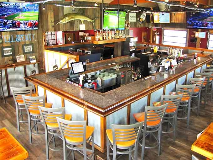 The wraparound bar serves as command central for drinks, sports viewing, and general good times throughout the day.
