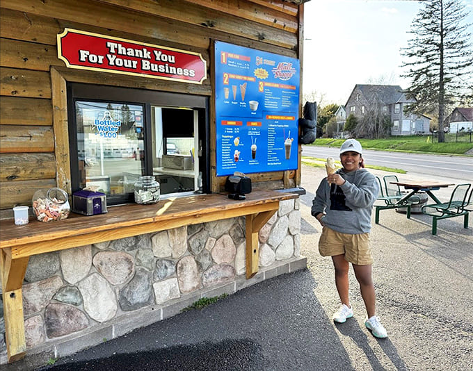 Customer: The universal gesture of ice cream approval—a thumbs up that says more than words ever could about 5th Street's frozen delights.