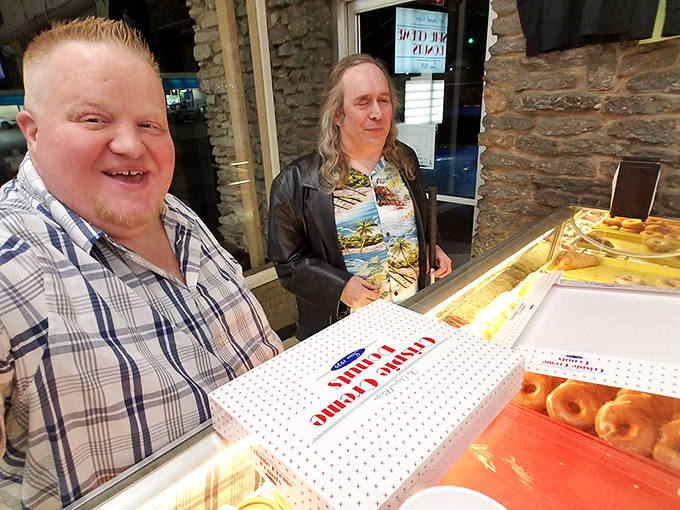 Happy customers clutching their prized donut boxes, about to spread joy throughout Chillicothe one sweet treat at a time.