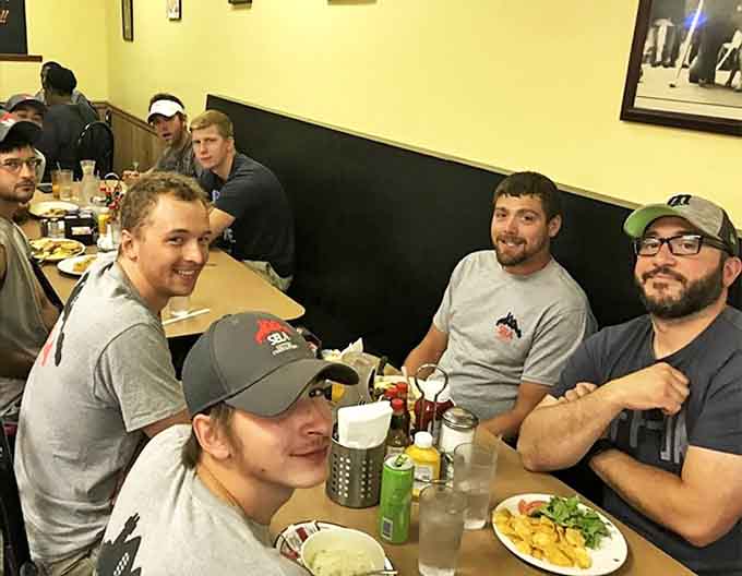Diners: Breakfast fellowship in action &ndash; where strangers become temporary friends united by the universal language of "pass the hot sauce."