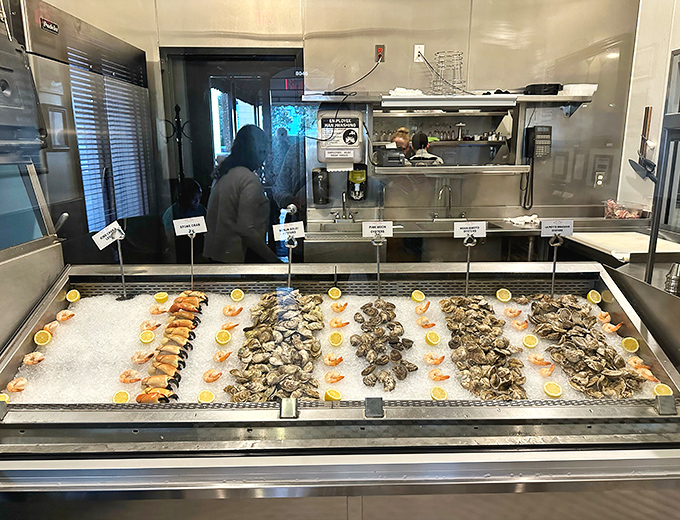 The raw bar display case showcases nature's bounty on ice – a glistening array of shellfish that makes choosing just one option nearly impossible.