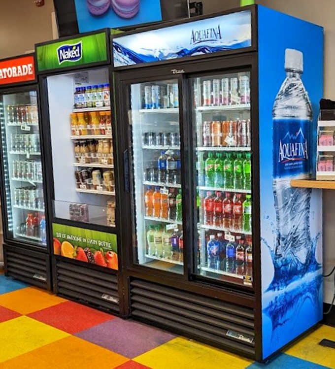 Decisions, decisions! The drink cooler stands ready to complement your sweet treats with refreshing options for every taste.