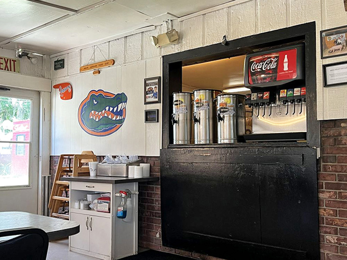 The drink station&mdash;where sweet tea flows like liquid gold and Florida Gators memorabilia watches over thirsty patrons with orange and blue pride.