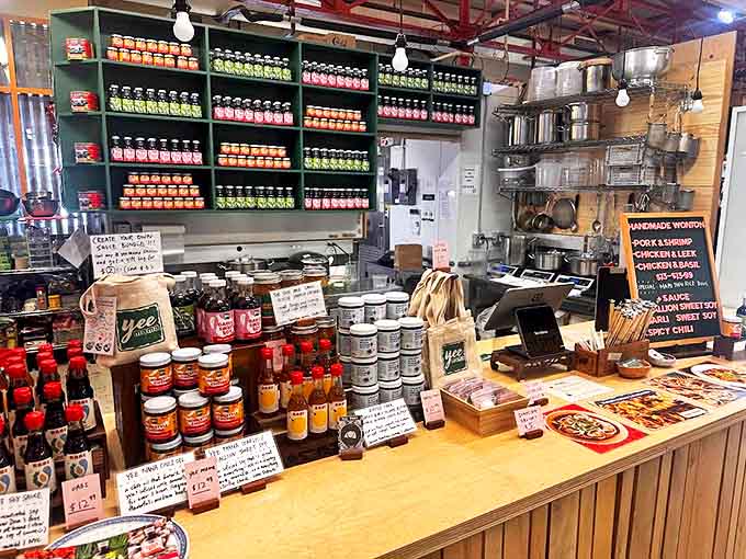 Bottles of homemade sauces stand at attention, each one a liquid ticket to flavor country without the hassle of a passport.