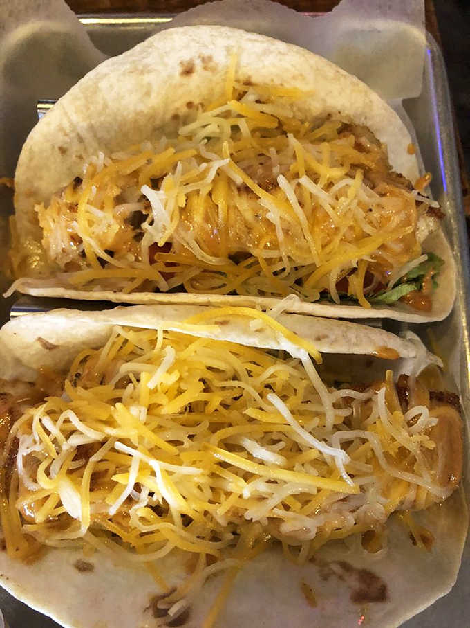 Cheese-topped treasures nestled in soft tortillas! These aren't just tacos &ndash; they're little pockets of joy that'll transport your taste buds.