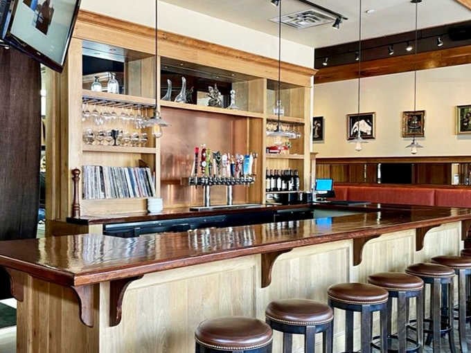 The polished bar showcases an impressive selection of local and craft beers on tap, with vinyl records hinting at the pub's musical soul.