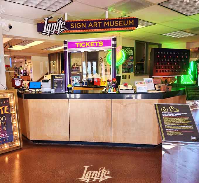 The ticket booth welcomes visitors to a museum that's part history lesson, part art gallery, and entirely delightful for anyone who appreciates glowing things.