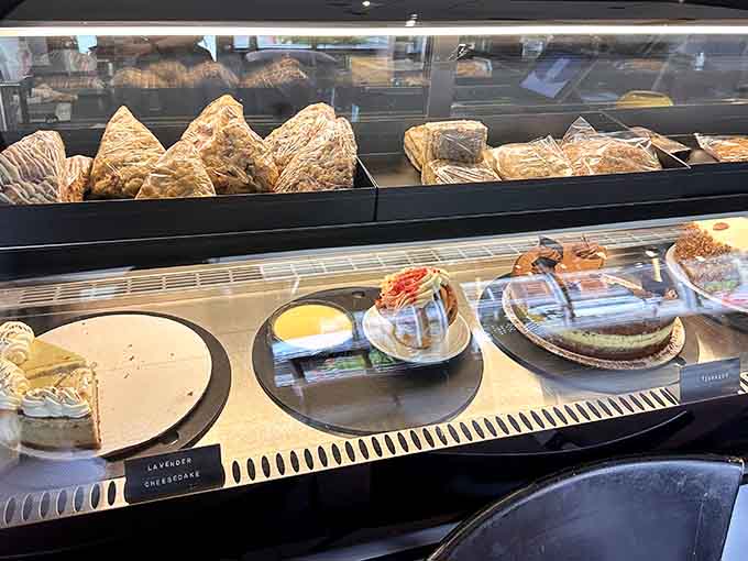 The dessert case tempts with cheesecakes and sweet treats that make "just coffee" nearly impossible to stick with.