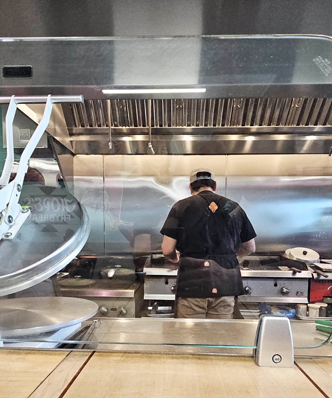Culinary theater at its finest &ndash; watching skilled hands transform simple dough into golden frybread is almost as satisfying as eating it.