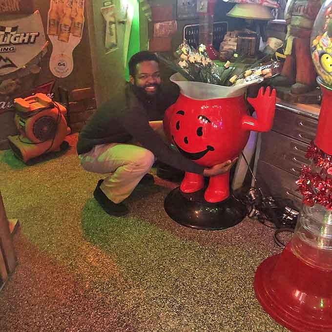 The Kool-Aid Man statue stands guard, his perpetual "OH YEAH!" expression perfectly capturing how you'll feel about your meal.