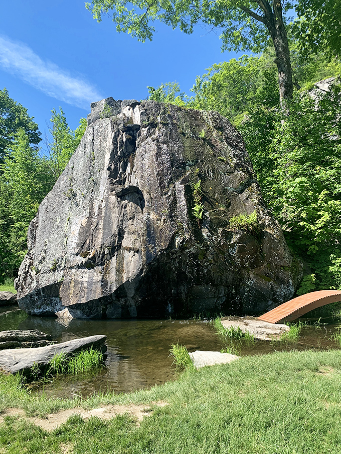 This imposing rock formation stands like nature's sculpture, its weathered face telling geological stories that make human problems seem delightfully temporary.