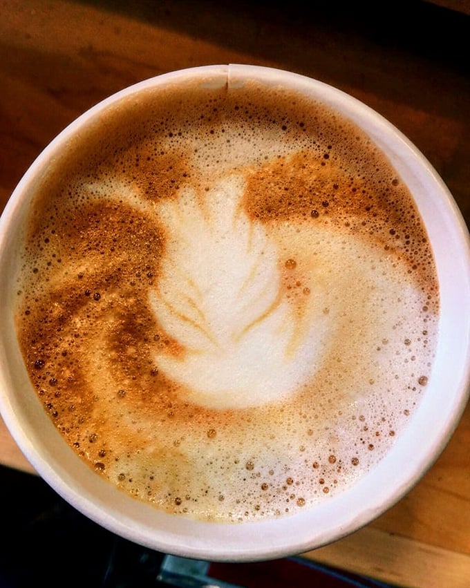 Coffee art that's almost too pretty to drink, until you remember that caffeine and biscuits are soulmates meant to be together.