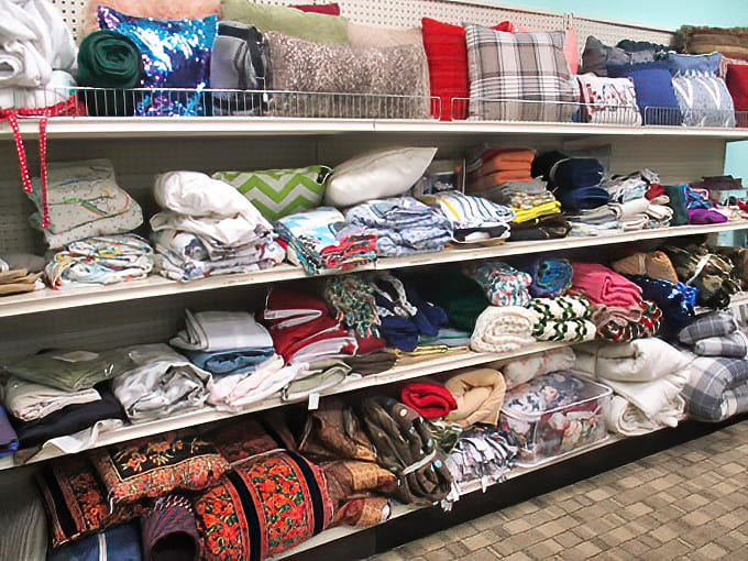 Bedding and linens in every imaginable pattern tell the story of American home decor trends through the decades.