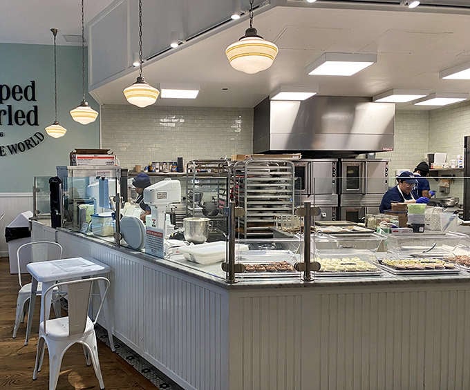 The open kitchen lets you watch the magic happen, where skilled bakers transform simple ingredients into reasons to celebrate being alive.