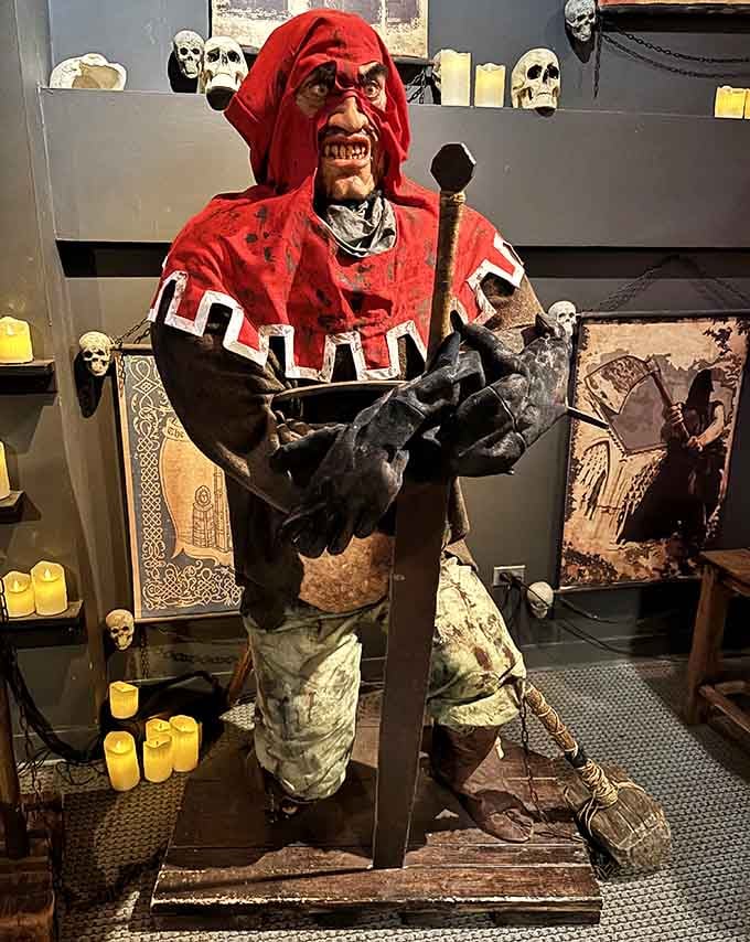 This grim figure clutching a severed head reminds visitors that medieval executioners were real people who made their living through violence.