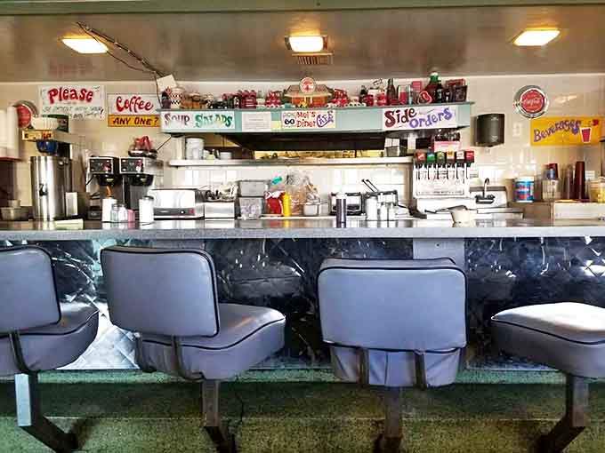 Counter seating offers front-row views of the kitchen action and the best spot for solo diners who enjoy watching their food prepared.