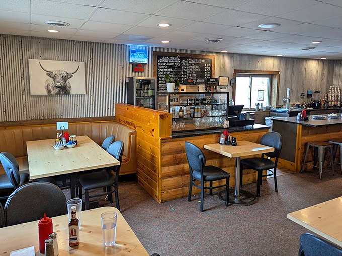 The dining area balances rustic charm with comfortable practicality, where conversations flow as freely as the coffee refills.