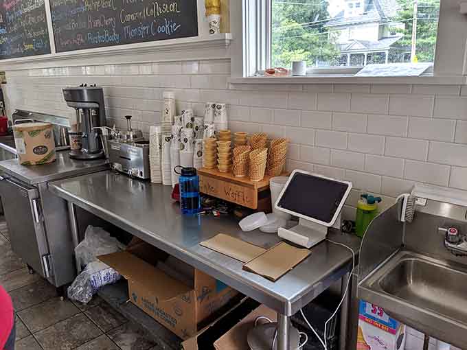 Behind the scenes, waffle cones stand ready for duty, soon to become edible vessels for frozen cargo they can barely contain.