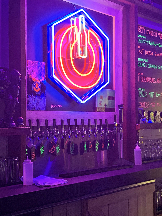 The tap wall glows with promise, each handle a gateway to craft beer nirvana that pairs perfectly with pixelated adventures.