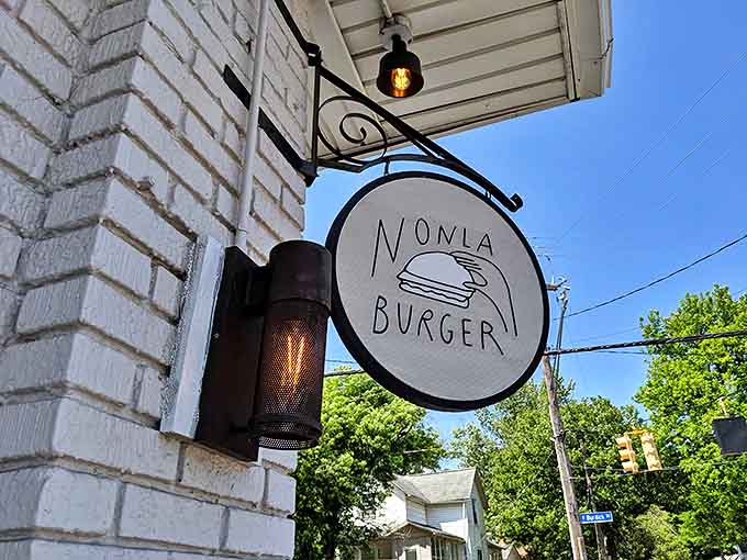 Corner Signage: The simple, iconic Nonla Burger sign serves as a beacon for those seeking burger enlightenment in Kalamazoo's culinary landscape.