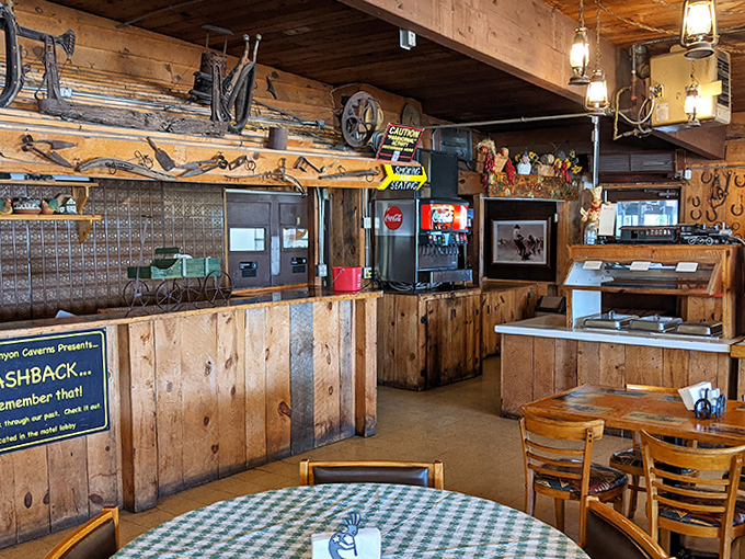 The rustic wooden interior of the caverns' restaurant serves up hearty American classics with a side of Route 66 nostalgia and Western charm.