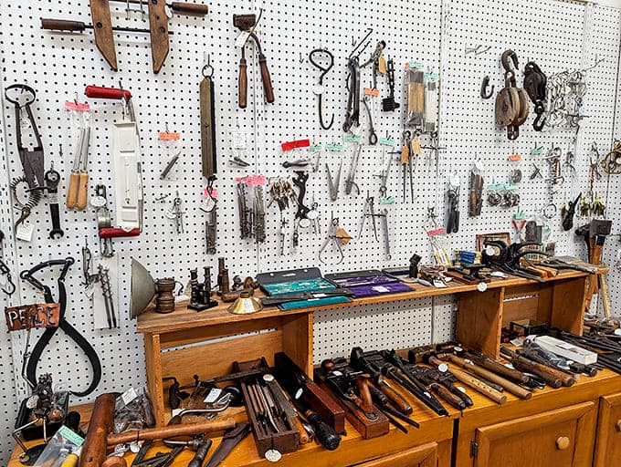 Tools that built America hang in silent testimony to craftsmanship and self-reliance – their wooden handles worn smooth by hands that knew how to fix rather than replace.
