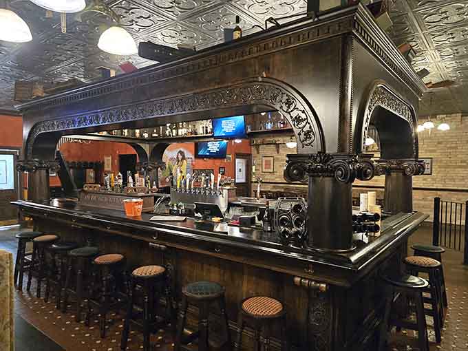 That ornate bar with its detailed metalwork and craftsmanship creates the perfect backdrop for countless conversations and celebrations.