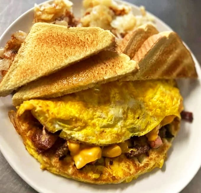 Breakfast architecture at its finest &ndash; a structurally sound omelet with toast points perfectly positioned for maximum yolk-sopping efficiency.