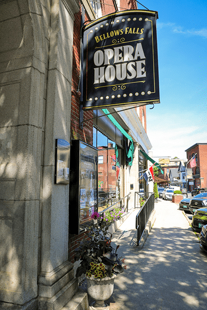 The Opera House sign beckons from brick walls, promising entertainment in a venue where generations have gathered for nearly a century.