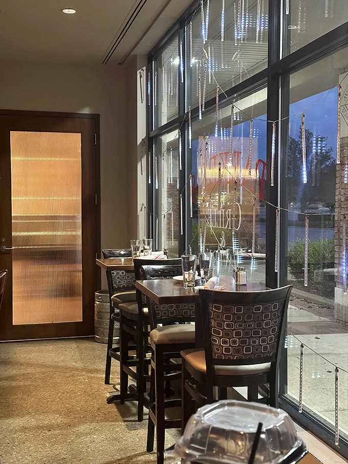 Window seating offers the perfect vantage point for people-watching while savoring culinary creations that demand your full attention.