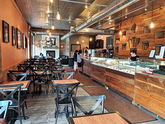 The dining area strikes that perfect balance between special and comfortable, with warm wood tones and industrial touches creating inviting ambiance.