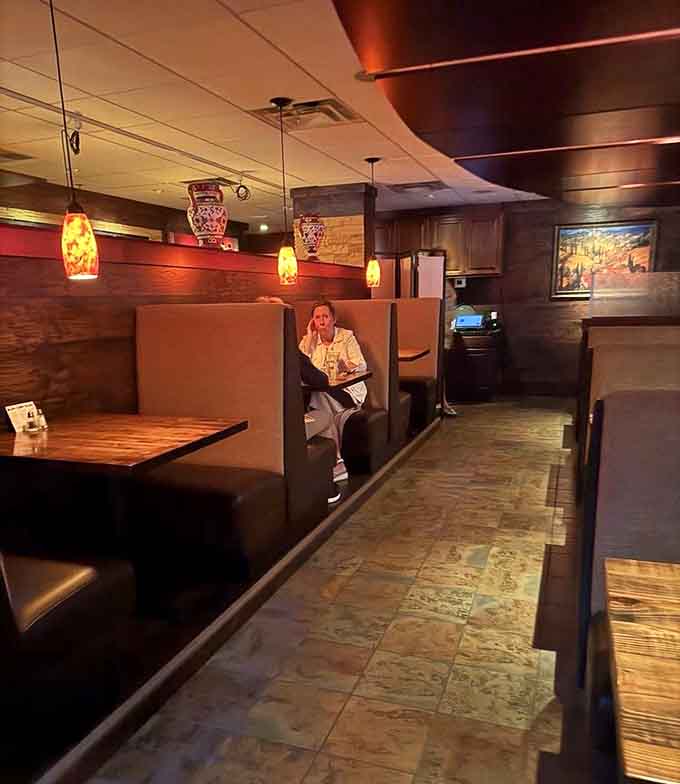 These cozy booths invite lingering conversations and multiple courses, the kind of seating that makes you forget about time and remember why dining out matters.