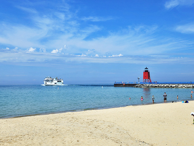 Charlevoix's lighthouse stands sentinel as the ferry passes, a postcard-perfect scene that's actually just everyday life along this blessed shoreline.