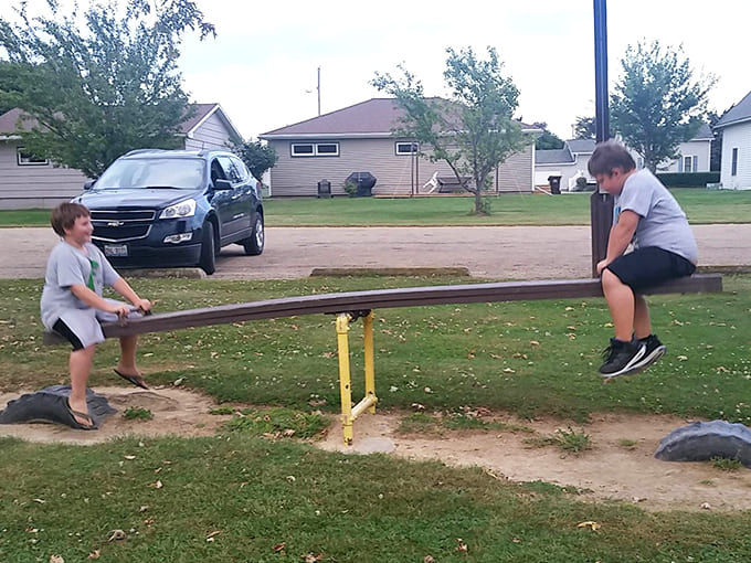 Dodds Park's playground equipment understands that seesaws teach valuable life lessons about balance, cooperation, and not abandoning your friends mid-air.