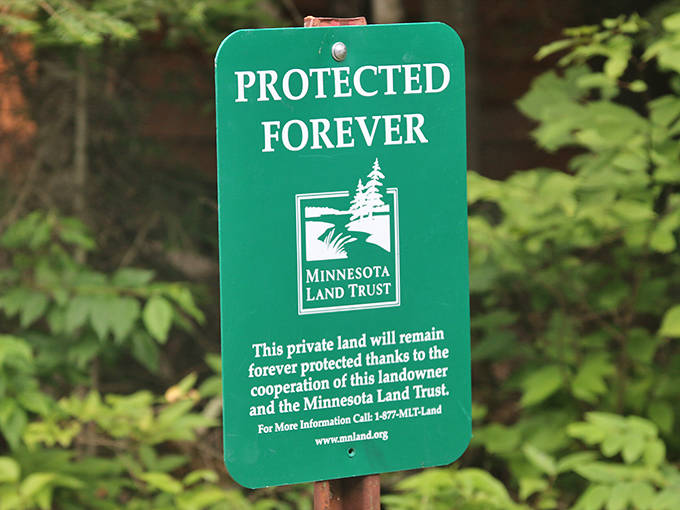 The green promise of preservation &ndash; this Minnesota Land Trust sign represents the commitment to keeping wild spaces truly wild.