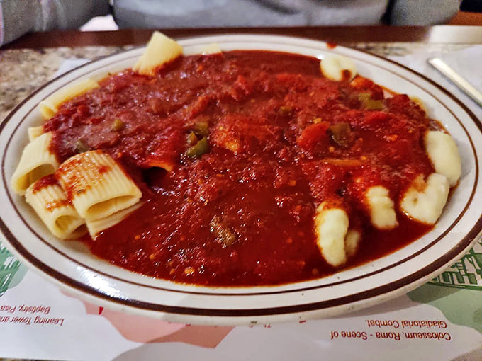 Ridged pasta tubes capture robust sauce in every bite, proving that sometimes the simplest dishes deliver the most satisfaction.