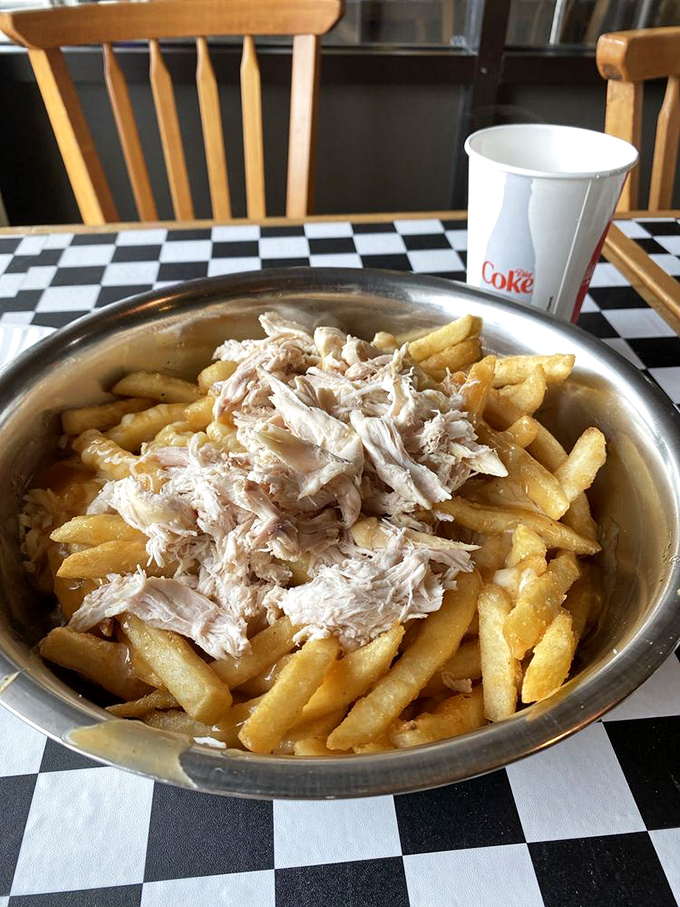 Chicken poutine that elevates French fries to main course status. Those tender morsels of rotisserie chicken nestled among the fries are little flavor bombs.