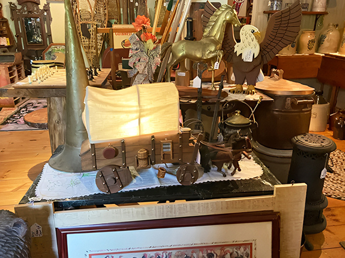 The organized chaos of a true antiquarian's paradise &ndash; where brass eagles soar above vintage kitchenware and every shelf tells multiple stories.