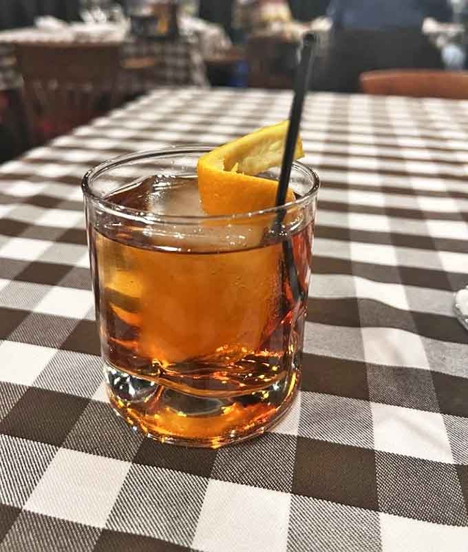 An Old Fashioned served the old-fashioned way, with an orange twist and respect for tradition.