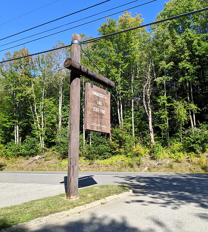 The rustic wooden sign welcomes visitors to this hidden gem. First-timers often drive past before realizing what they've almost missed.