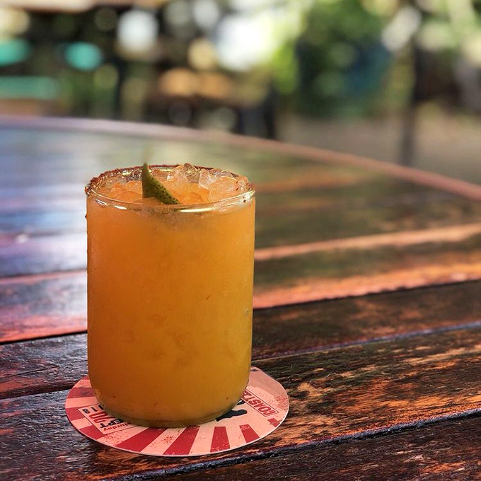 This golden elixir, rimmed with salt and garnished with lime, promises to transport you to a tropical state of mind with every sip.