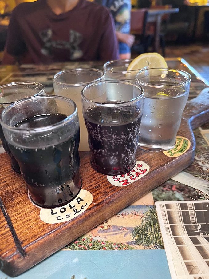 The soda flight presents a rainbow of house-made refreshments, proving even the beverages at Satchel's refuse to be ordinary.