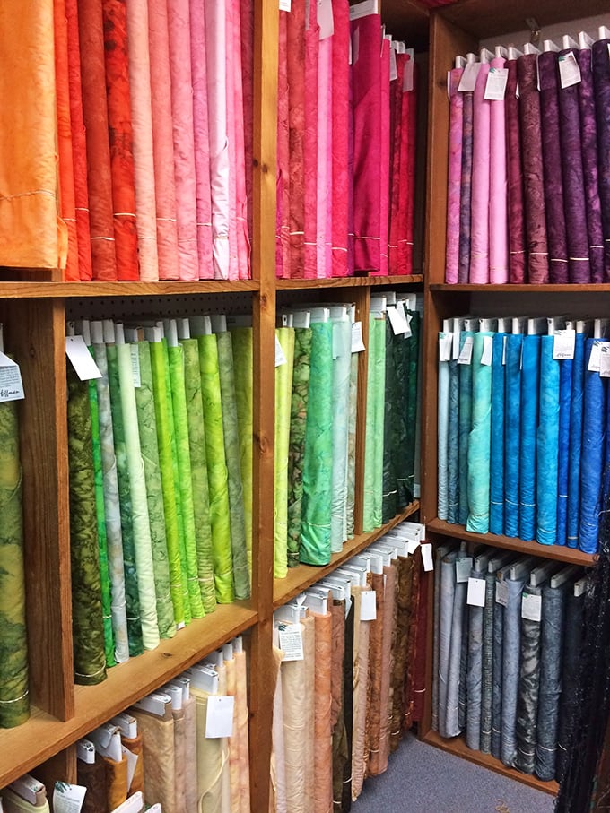 The solid fabric section organizes colors with such precision that interior designers regularly experience tears of joy here.