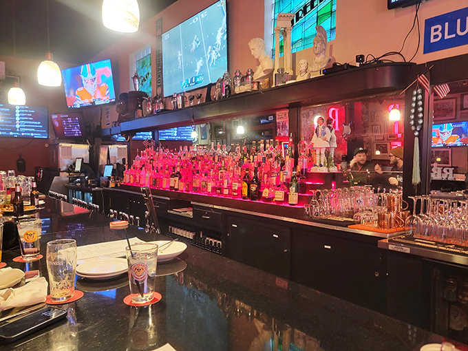 Bottles glow like beacons of possibility behind the bar, while TVs stand ready to broadcast triumph or heartbreak to faithful fans.